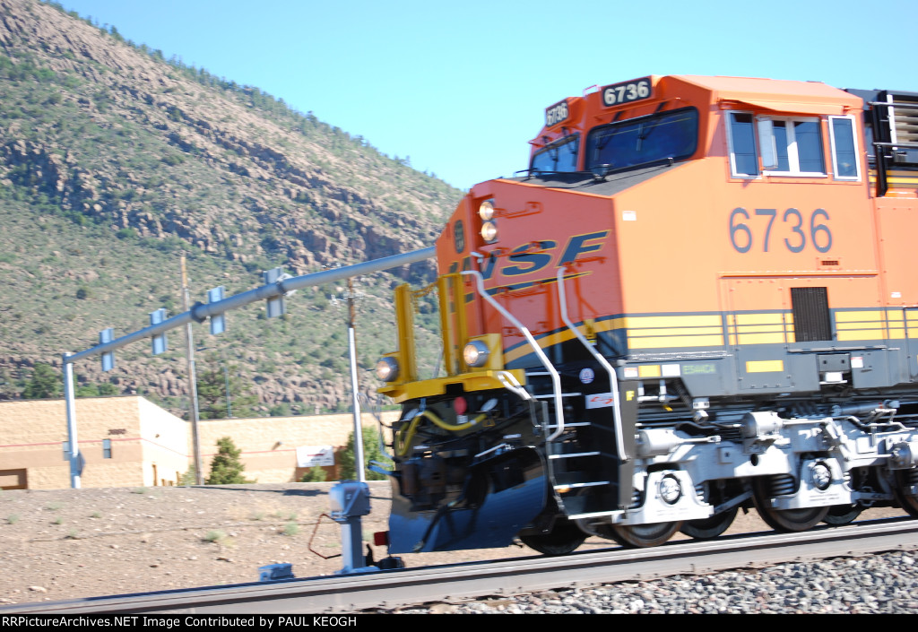 Zoom in shot of BNSF 6736 A Very Brand New ES44C4 as she passes me by heading Westbound towards ...